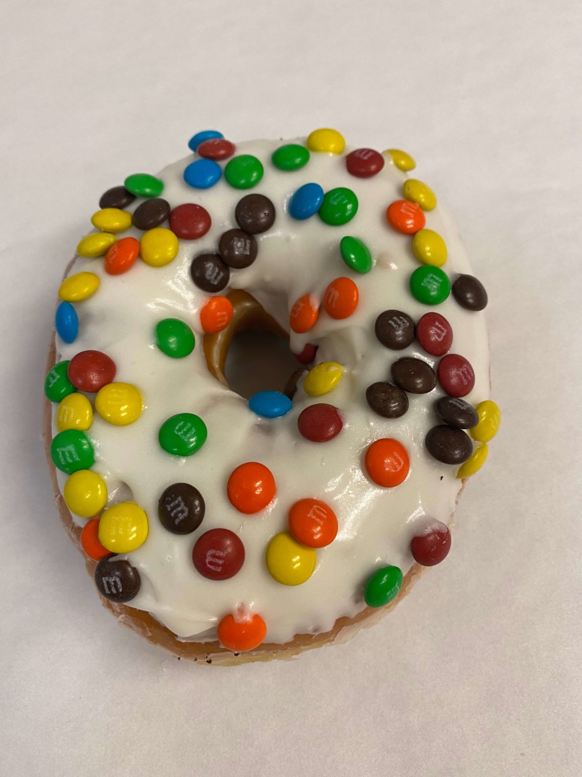 White Iced Raised Ring with M&M’s Donut | Wedding Cakes Minneapolis ...